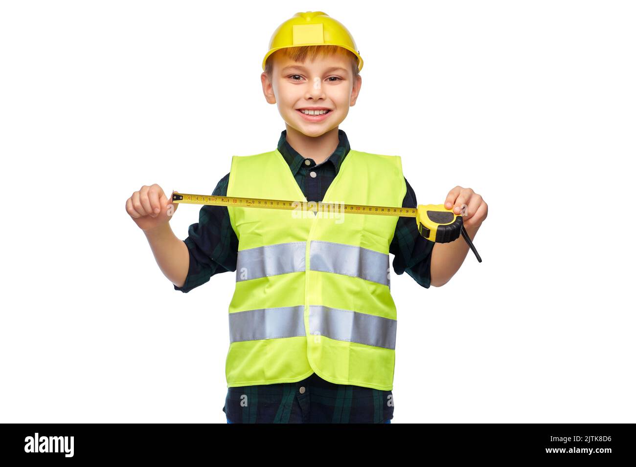boy in construction helmet and vest with ruler Stock Photo - Alamy