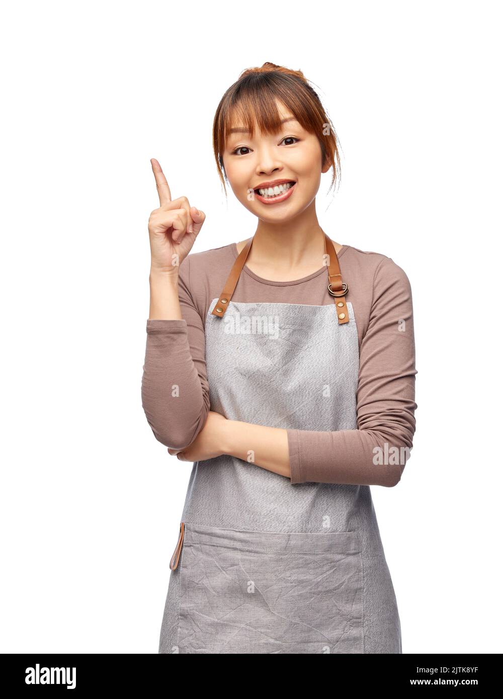 happy woman, chef or waitress pointing finger up Stock Photo - Alamy