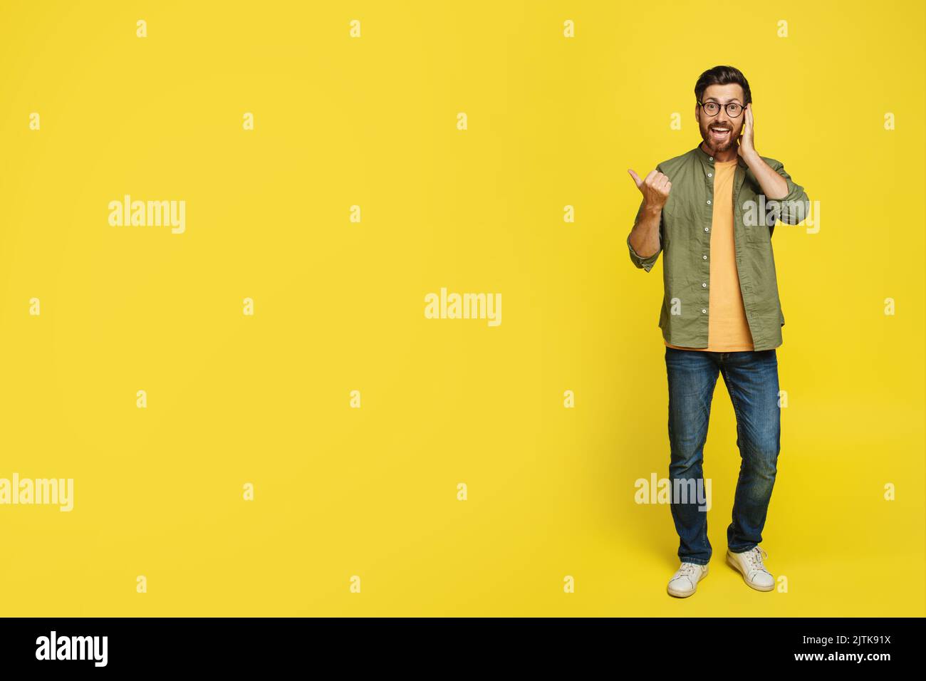 Surprised man pointing text hi-res stock photography and images - Alamy