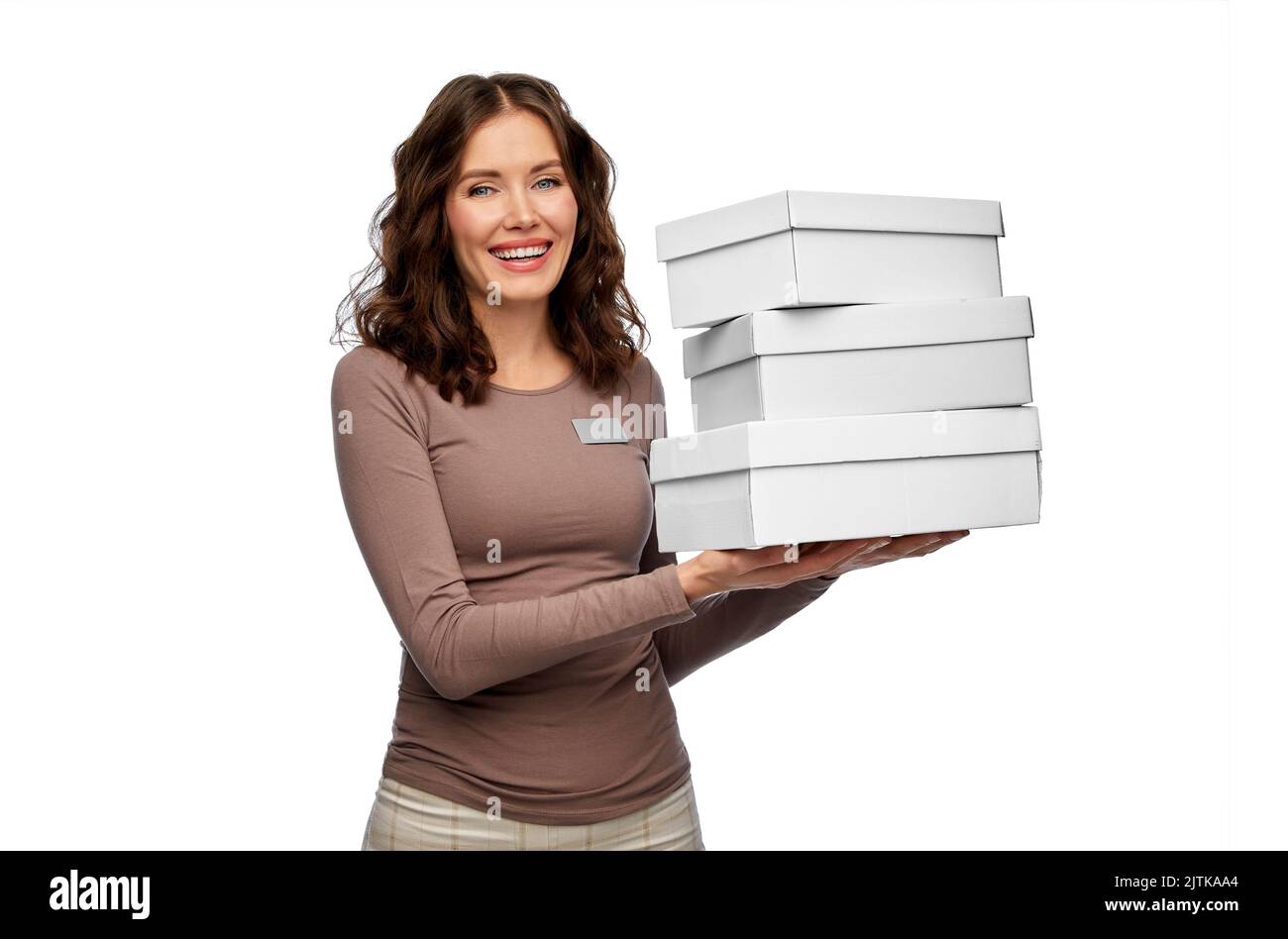 happy female shop assistant holding shoe boxes Stock Photo - Alamy