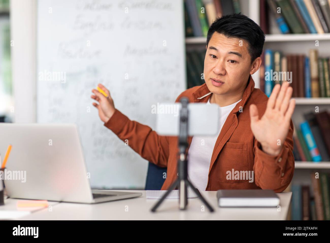 Chinese Teacher Man Making Video Call Via Cellphone In Classroom Stock ...