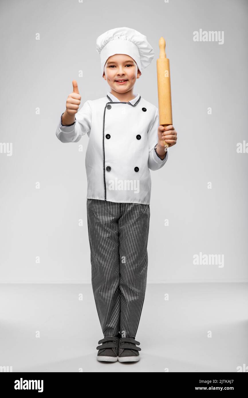 chef boy with rolling pin showing thumbs up Stock Photo - Alamy