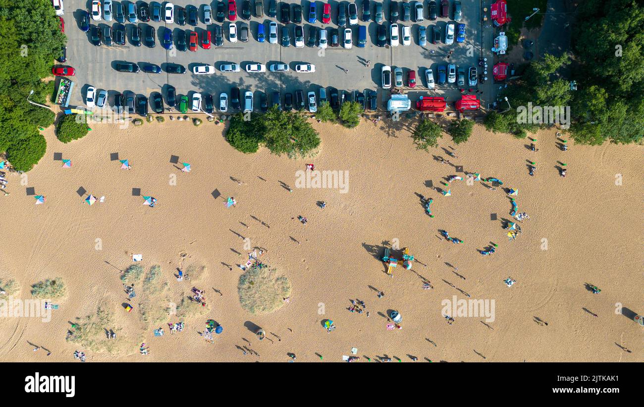 Drone view of the beach and people resting Stock Photo - Alamy