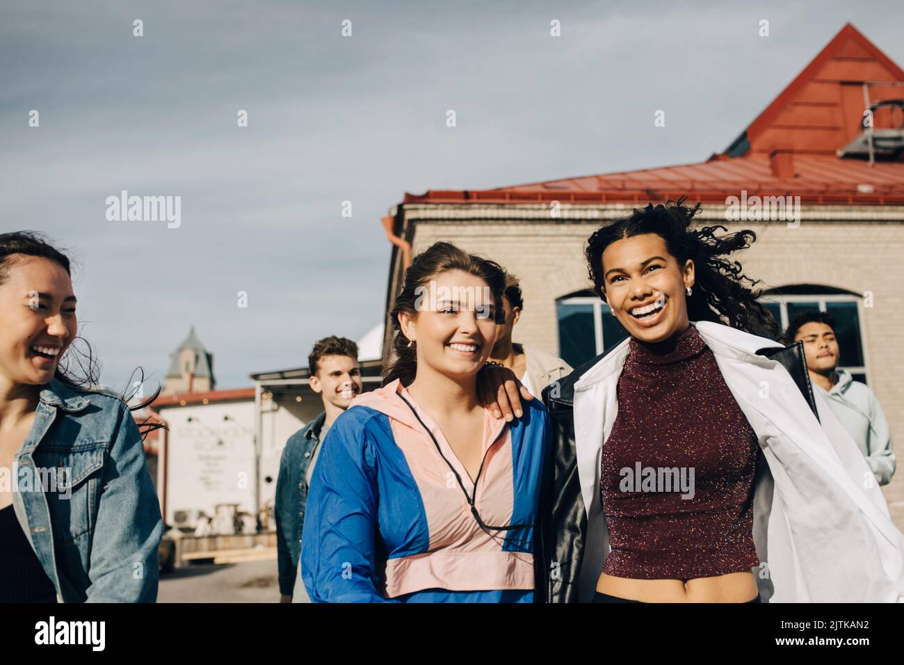 Happy multiracial group friends enjoying hi-res stock photography and images - Alamy