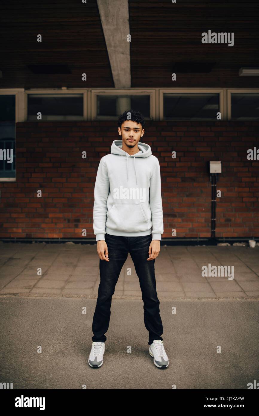 Full portrait of young man standing hi-res stock photography and images ...