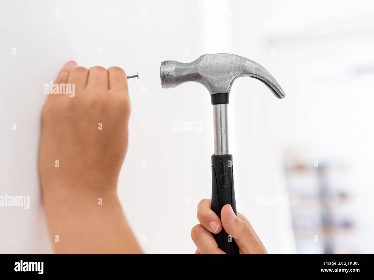 Nailing hands hi-res stock photography and images - Alamy