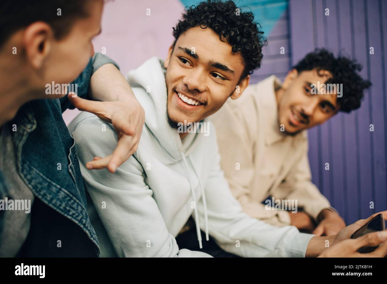 Group young gen friends sitting hi-res stock photography and images - Alamy
