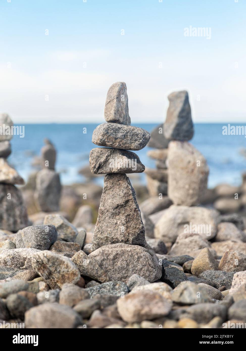 close up of stone pyramids or towers on beach Stock Photo - Alamy