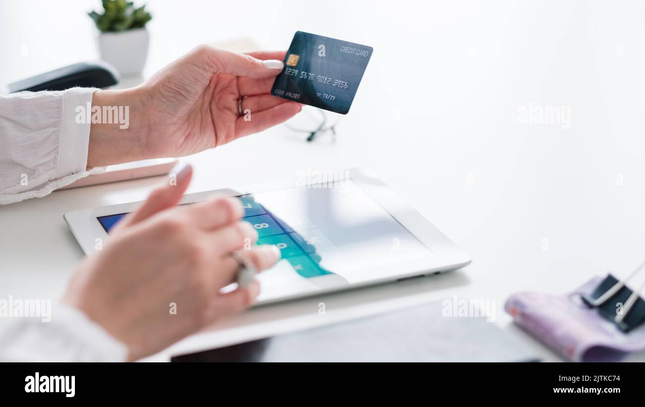 online banking credit card payment woman tablet Stock Photo - Alamy