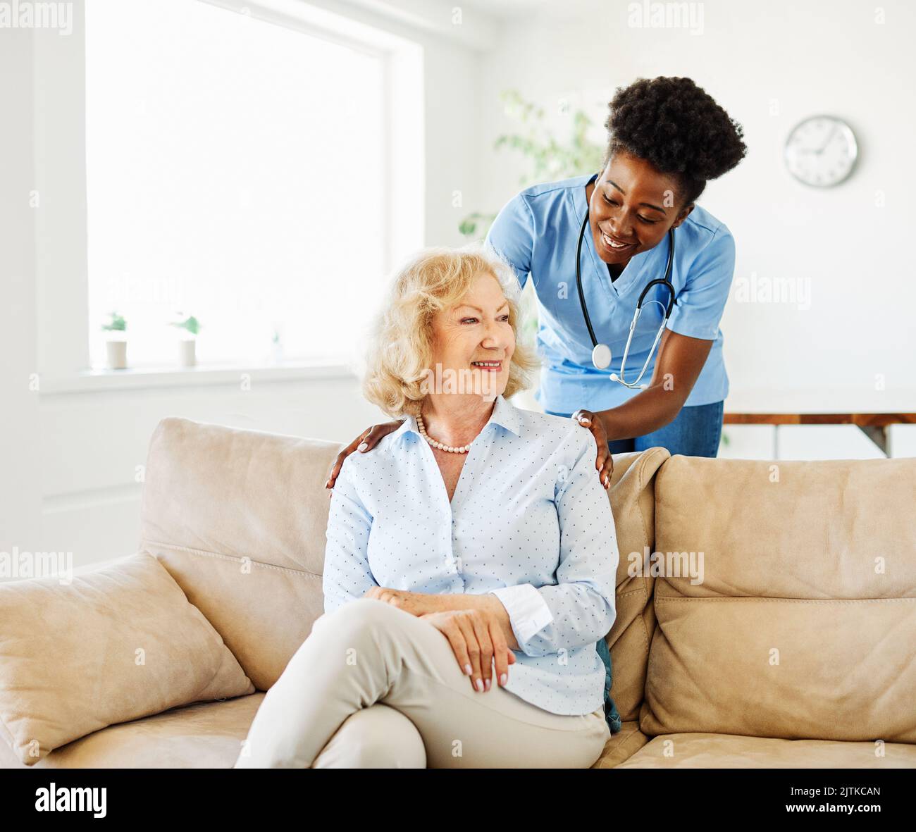 Young black female caregiver helping hi-res stock photography and images - Alamy
