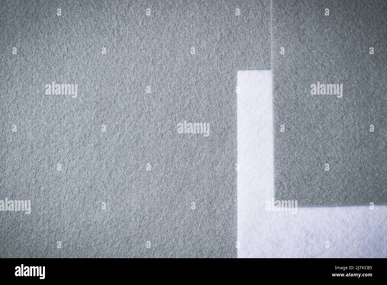 Abstract geometric felt texture background. White and gray colors felt ...