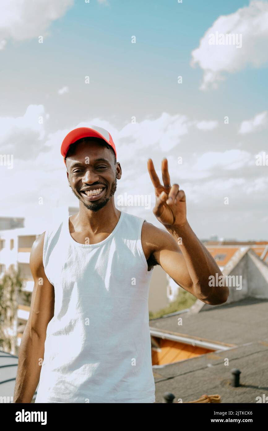 Young man wearing sign hi-res stock photography and images - Alamy