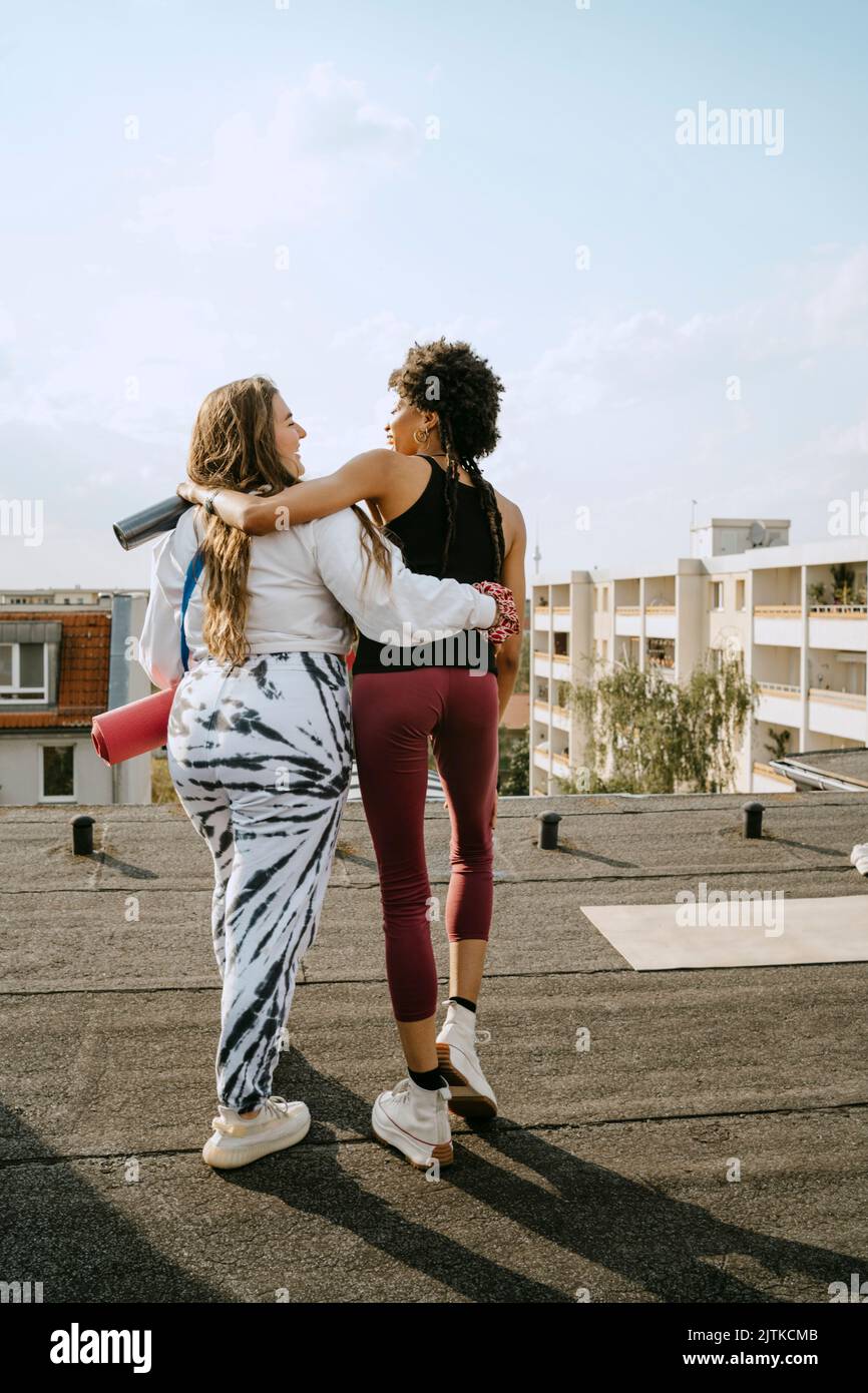 Two friends walk arms around hi-res stock photography and images - Alamy