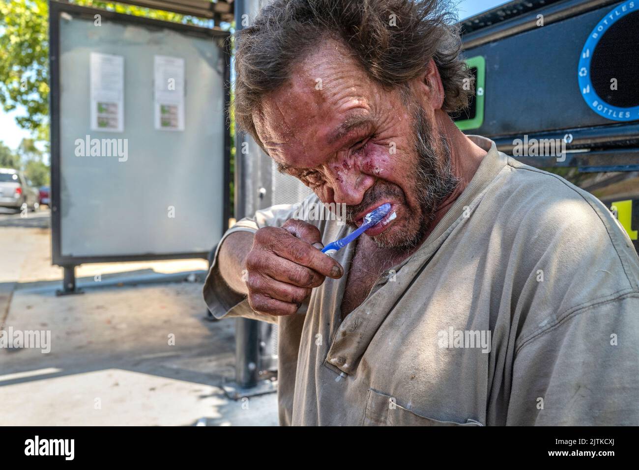 Vacaville, California, USA. 27th July, 2022. MARK RIPPEE, 59, brushes ...