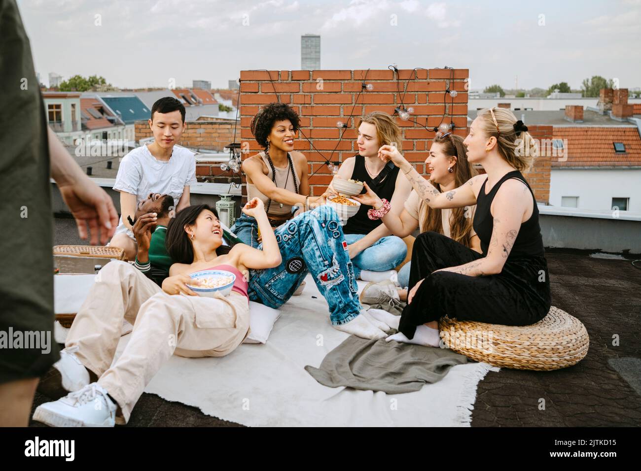 Happy multiracial friends enjoying party on rooftop Stock Photo - Alamy
