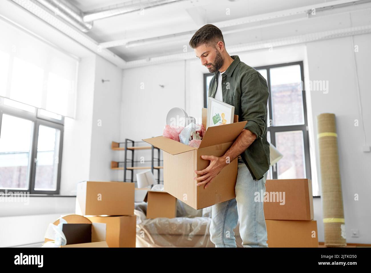 man with boxes moving to new home Stock Photo - Alamy