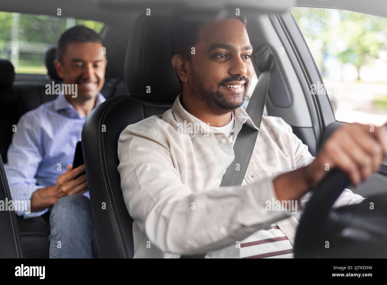 indian male driver driving car with passenger Stock Photo - Alamy