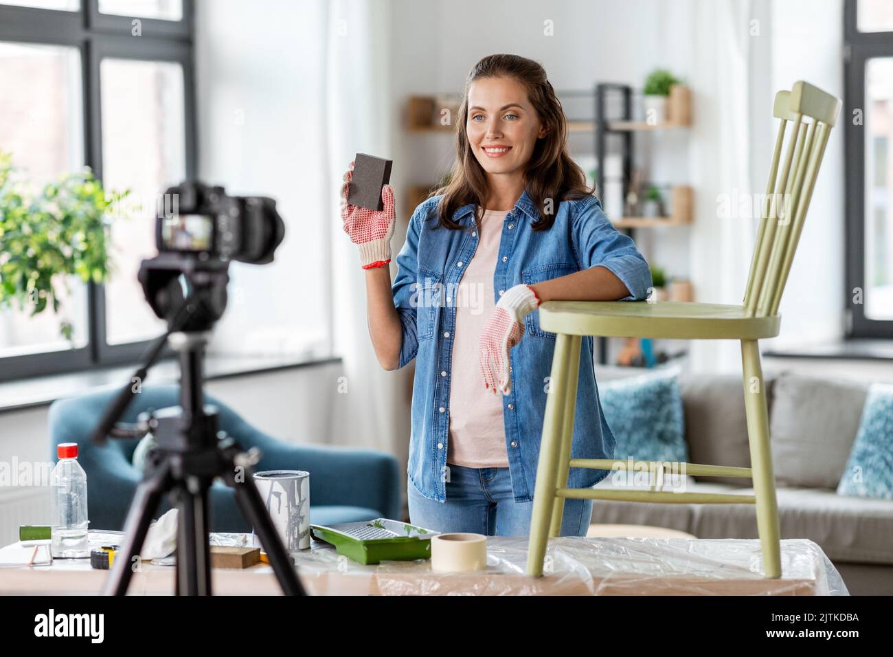 woman or blogger showing old chair renovation Stock Photo - Alamy