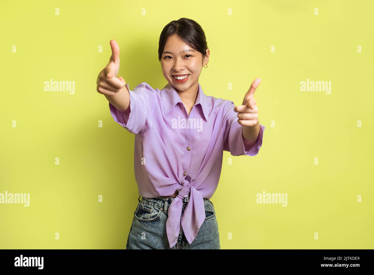 Happy Asian Lady Pointing Fingers To Camera Over Yellow Background ...