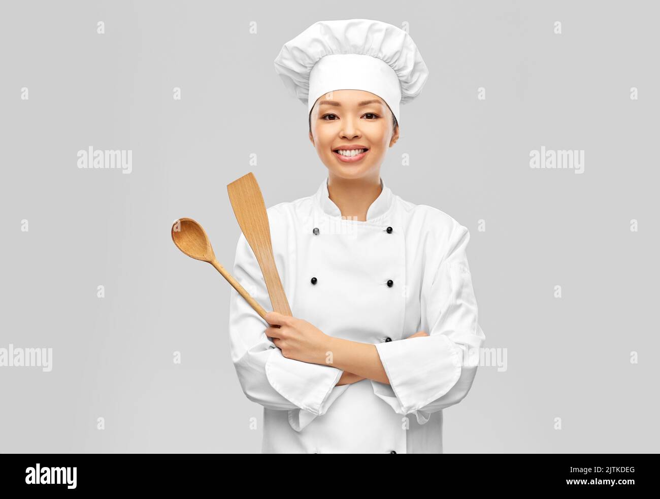 happy smiling female chef with wooden spoon Stock Photo - Alamy