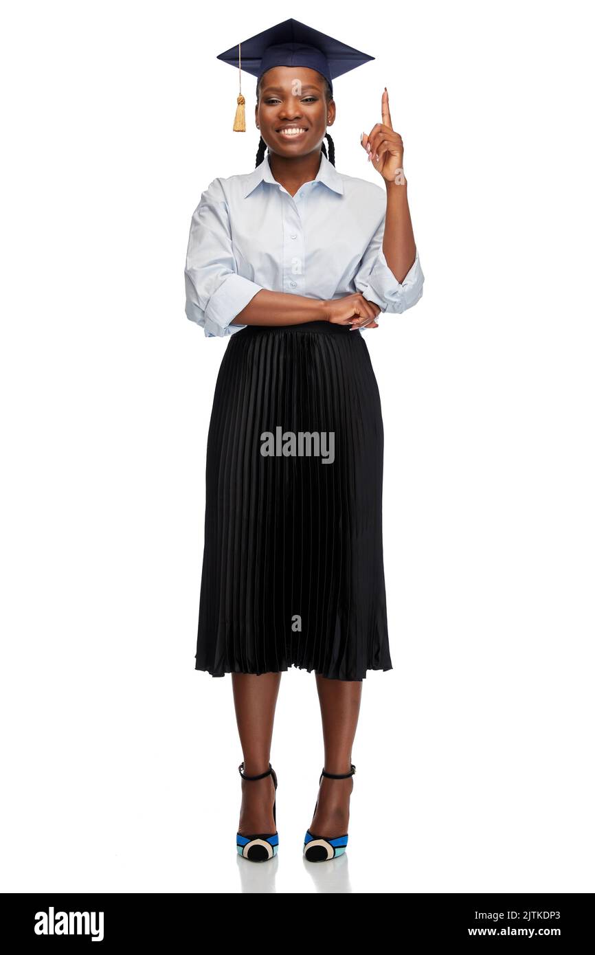 happy female graduate student pointing finger up Stock Photo - Alamy