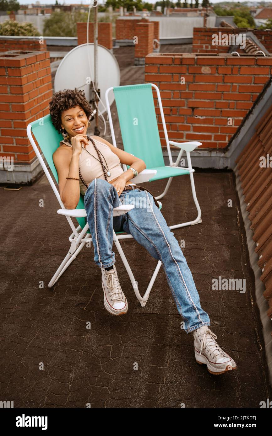 Woman sitting chair full length hi-res stock photography and images - Alamy