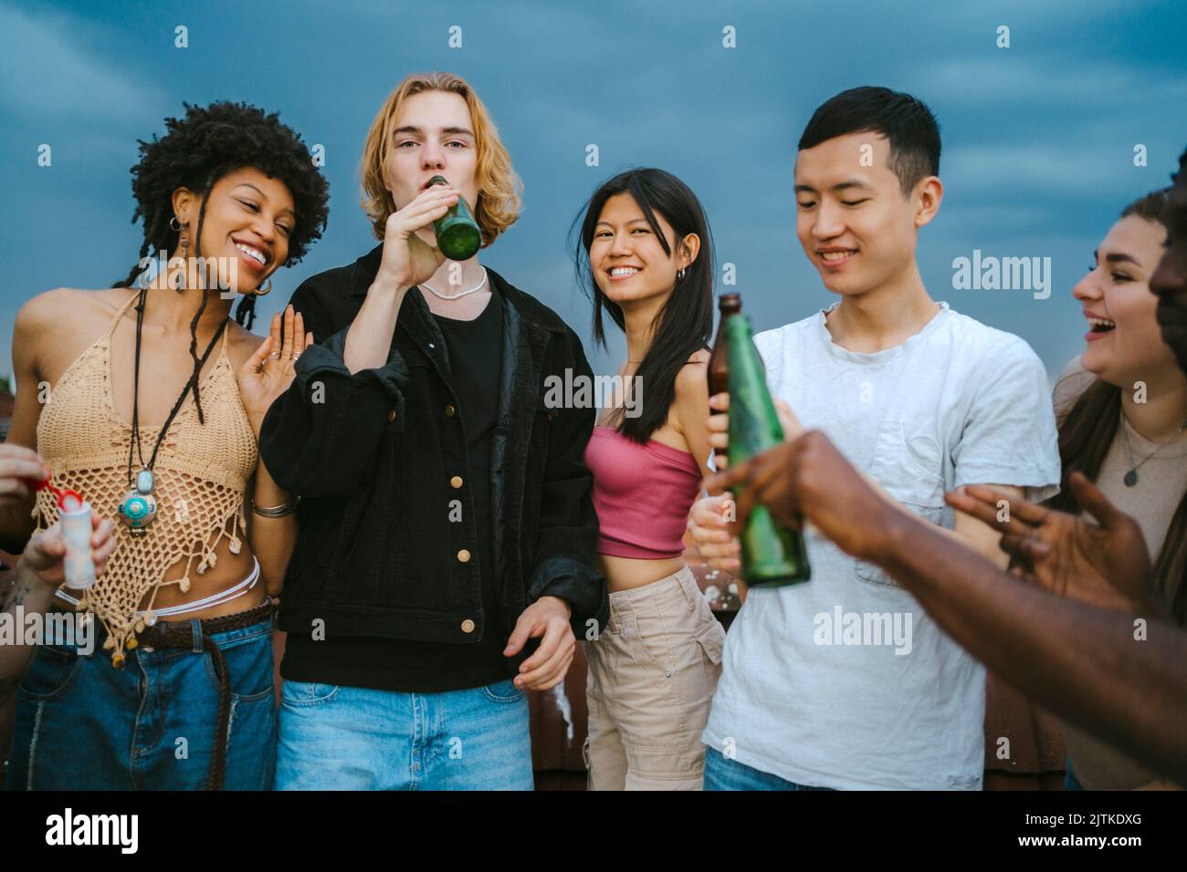 Young multiracial people drinking hi-res stock photography and images ...