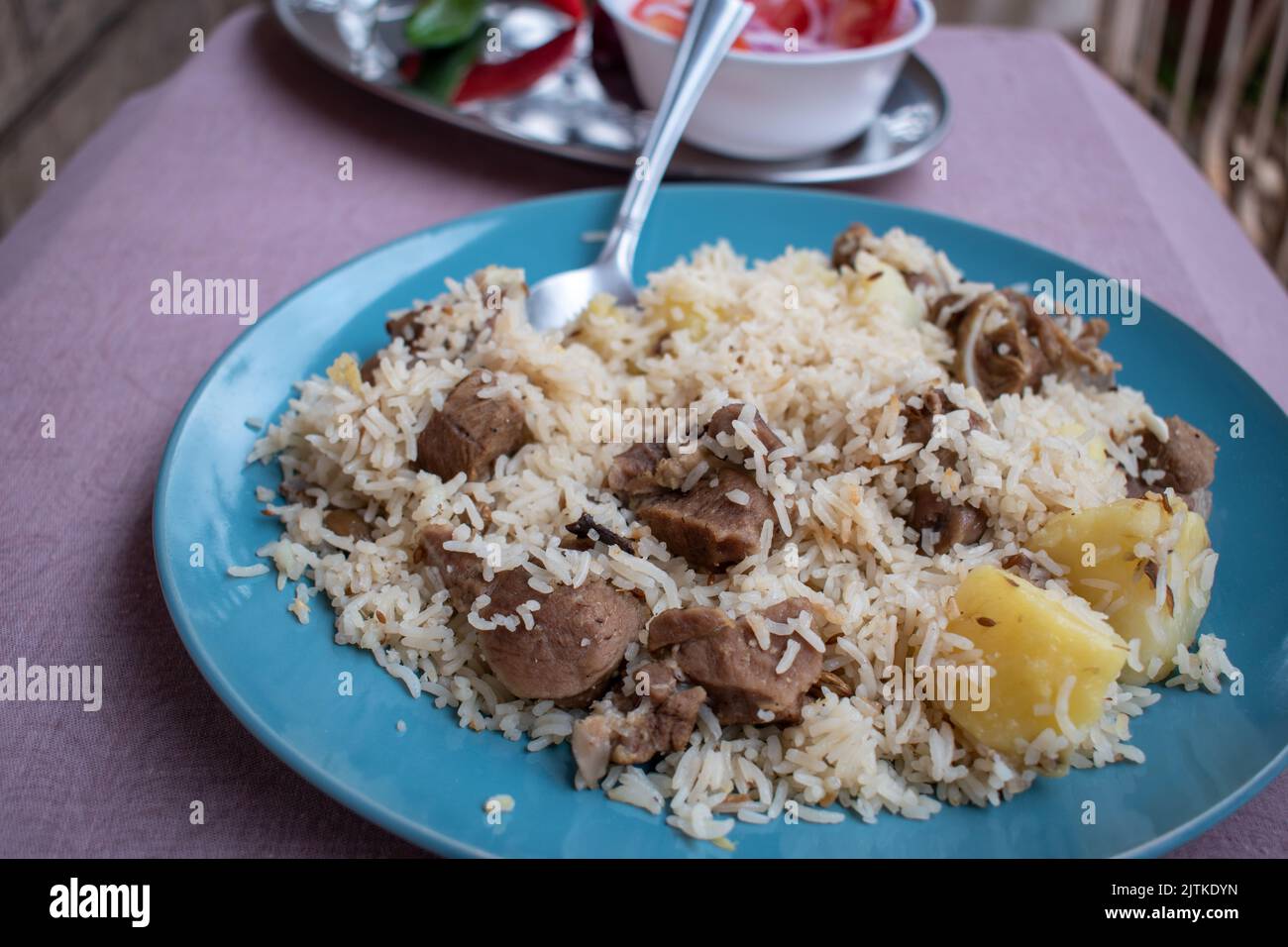 A plate of Kenyan pilau from a dinner's perspective Stock Photo - Alamy