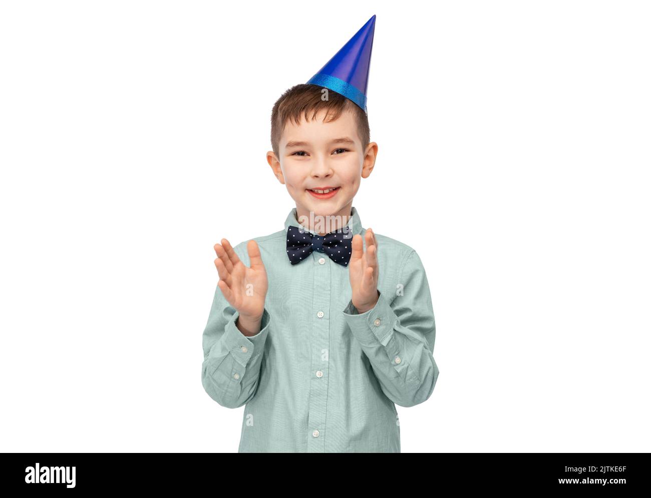 smiling boy in birthday party hat clapping hands Stock Photo - Alamy