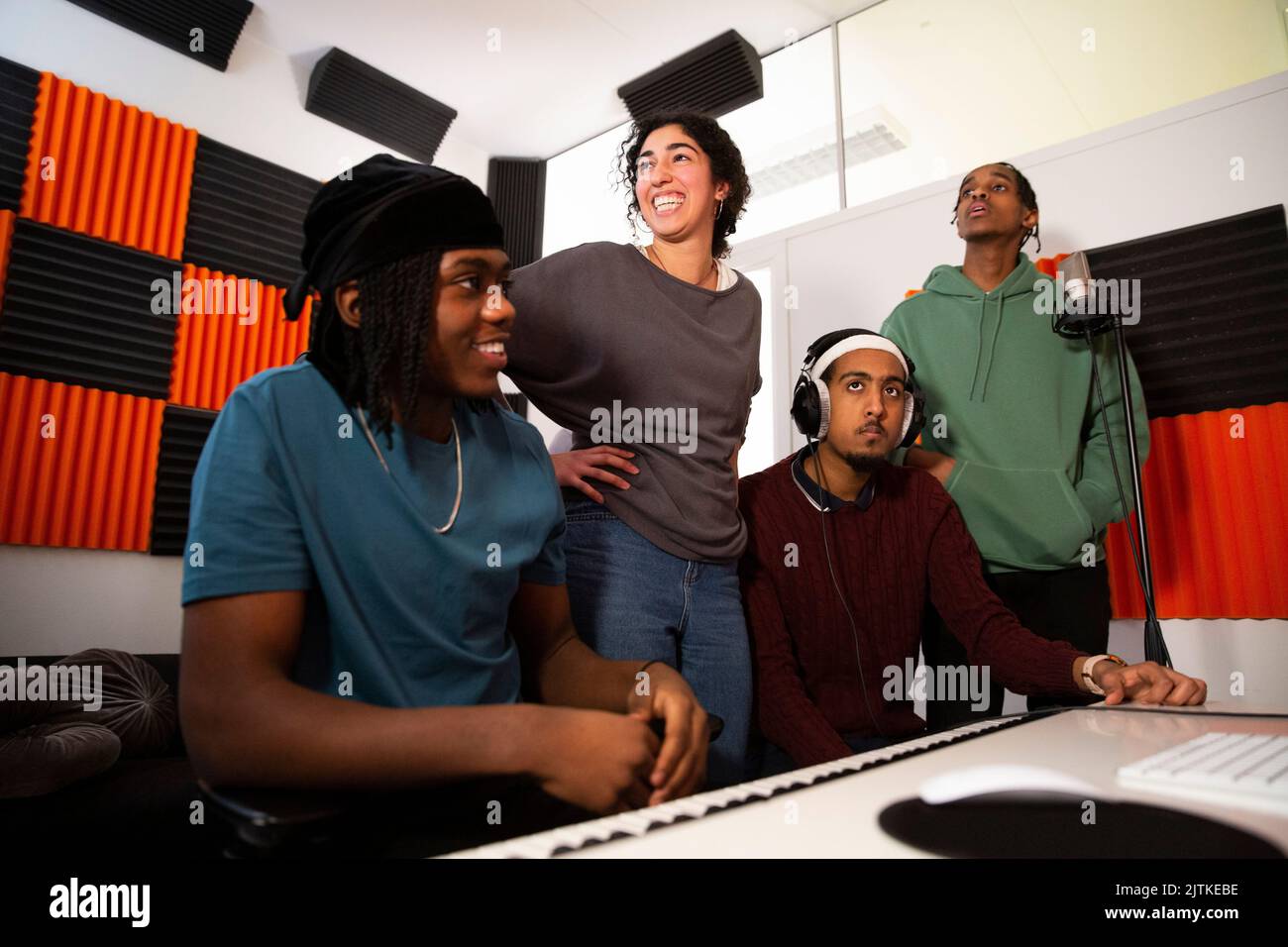 Portrait of musicians working in recording studio Stock Photo - Alamy