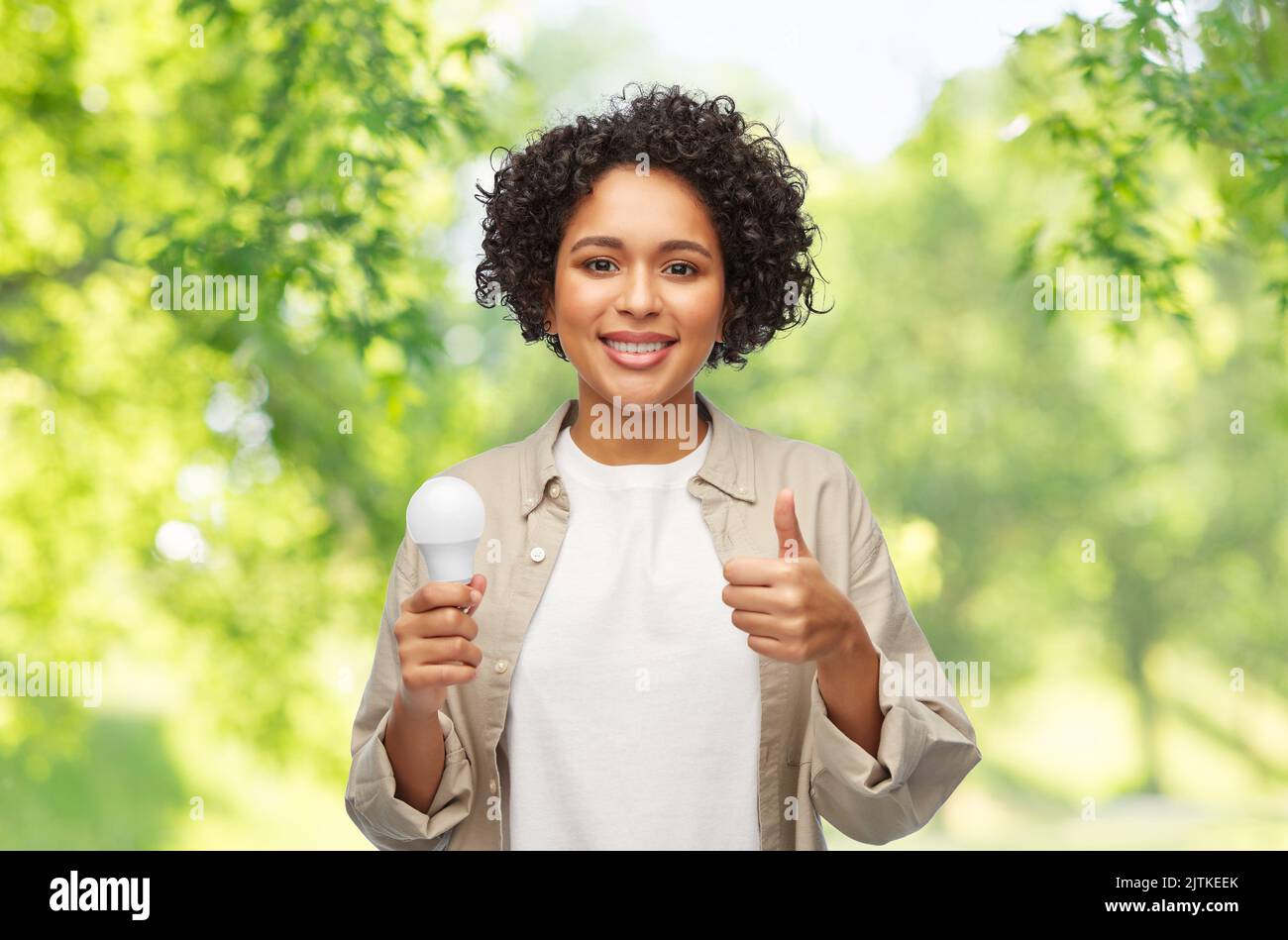 African woman lighting up hi-res stock photography and images - Alamy