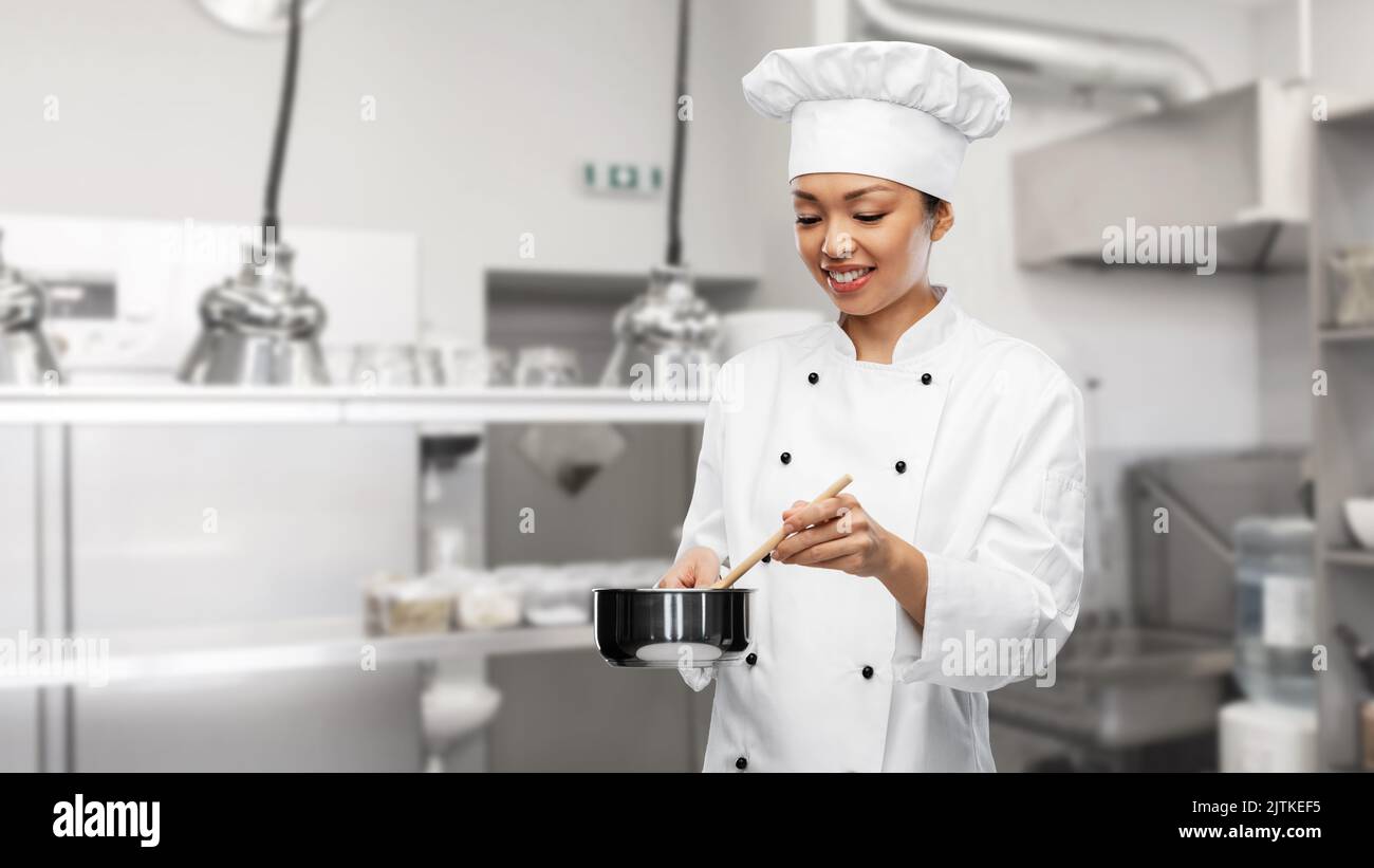 Happy smiling female chef hi-res stock photography and images - Alamy