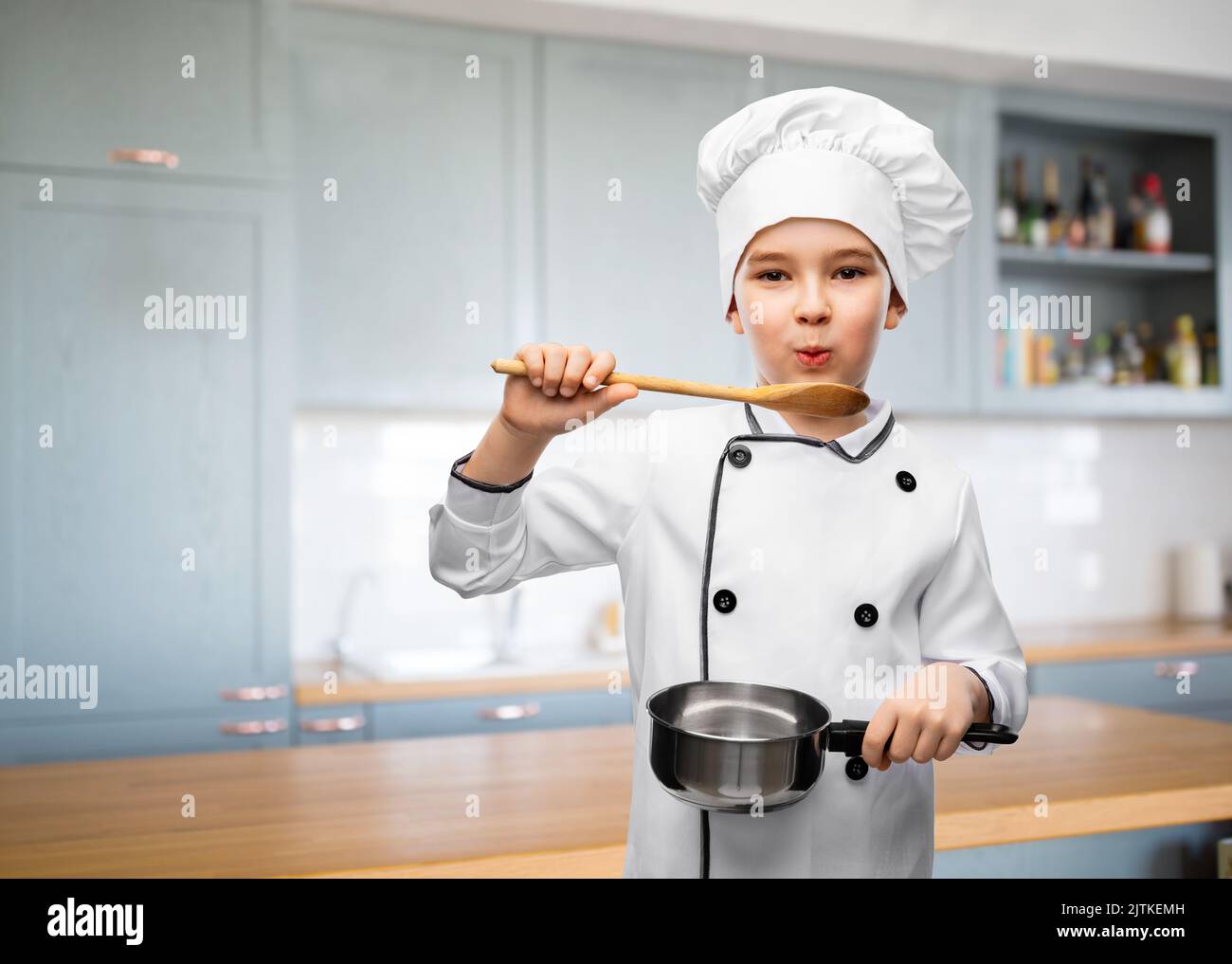 Teen boy cooking in the kitchen hi-res stock photography and images - Alamy