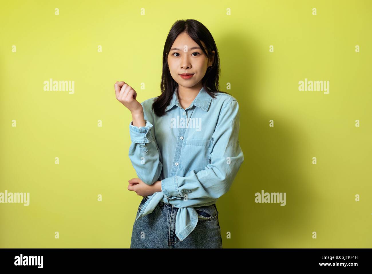 Japanese Millennial Lady Posing Looking At Camera Over Yellow ...