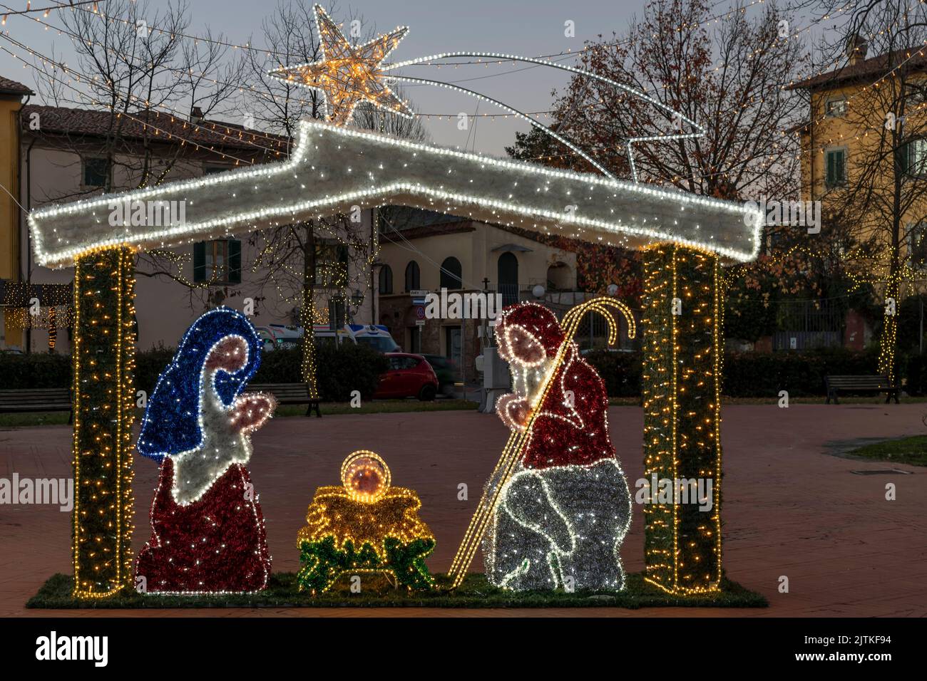 A Christmas nativity scene made with colored lights in the historic ...