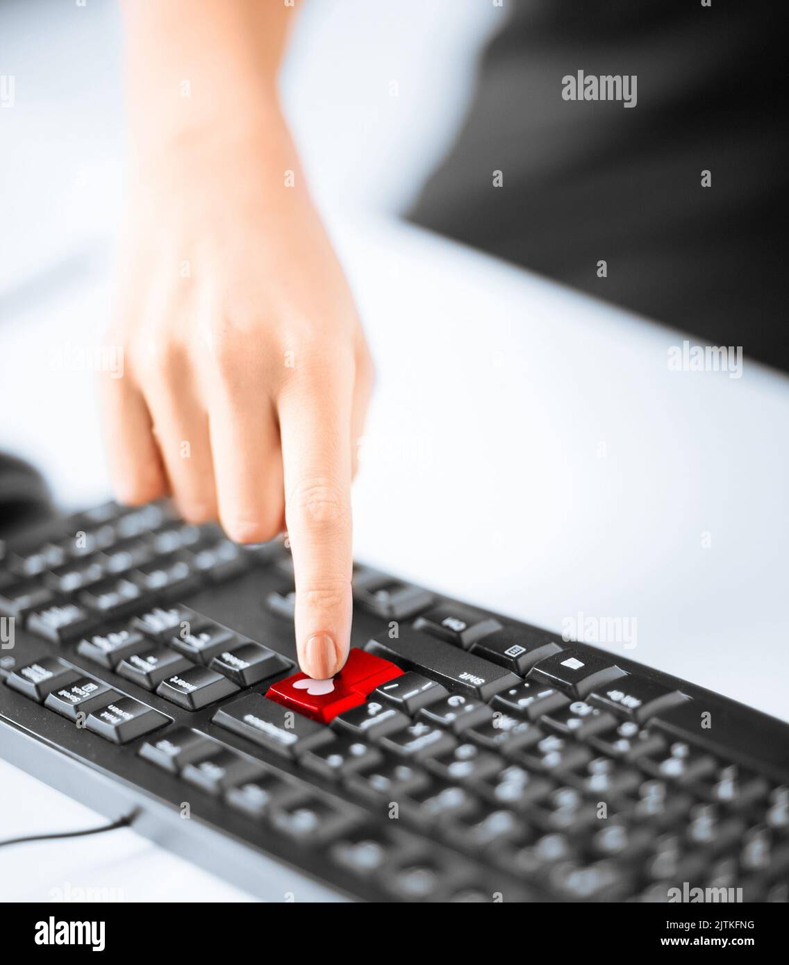 hand pressing red button with heart on keyboard Stock Photo - Alamy