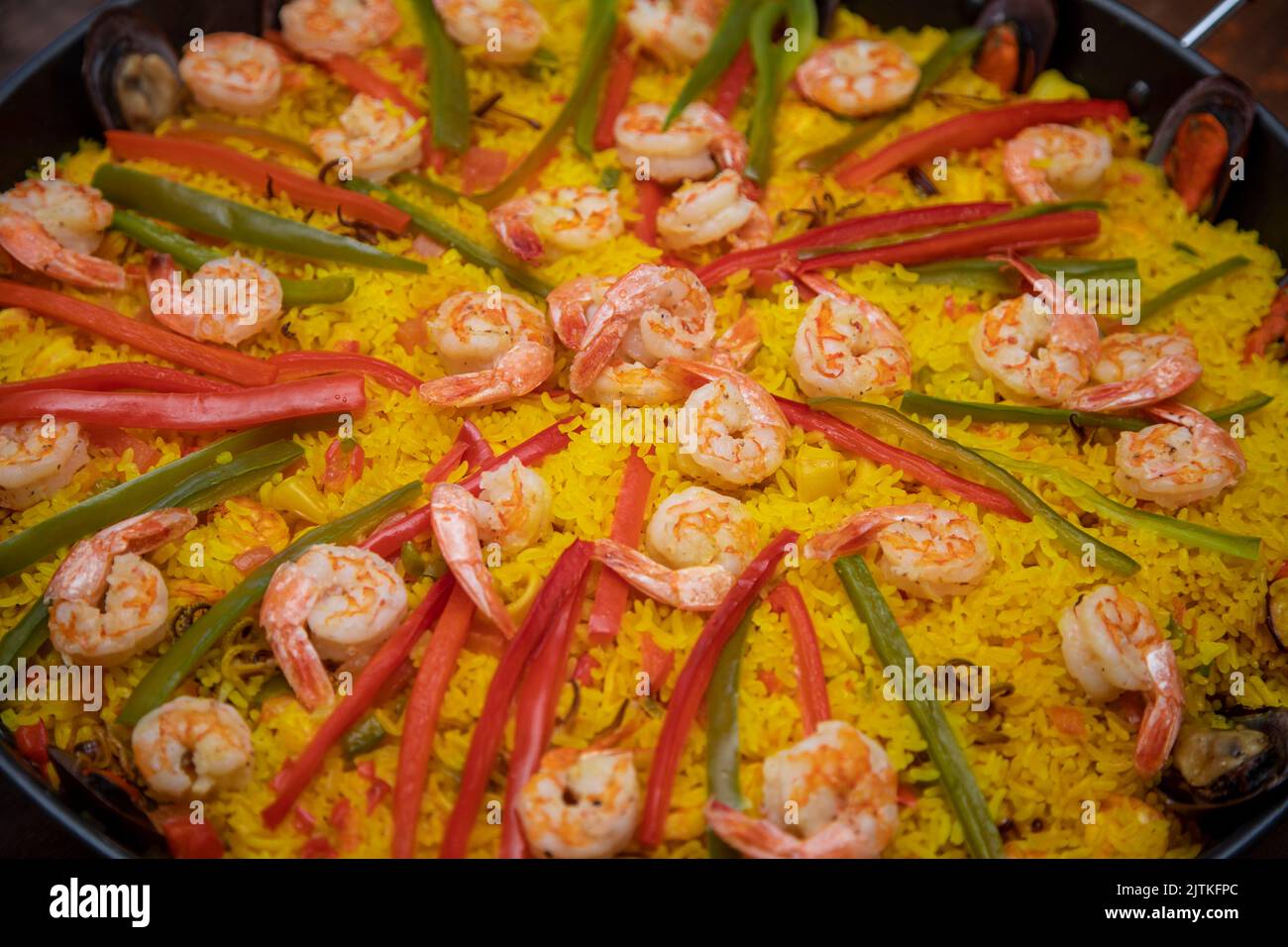 Cooking a paella spanish traditional food Valencia Stock Photo - Alamy