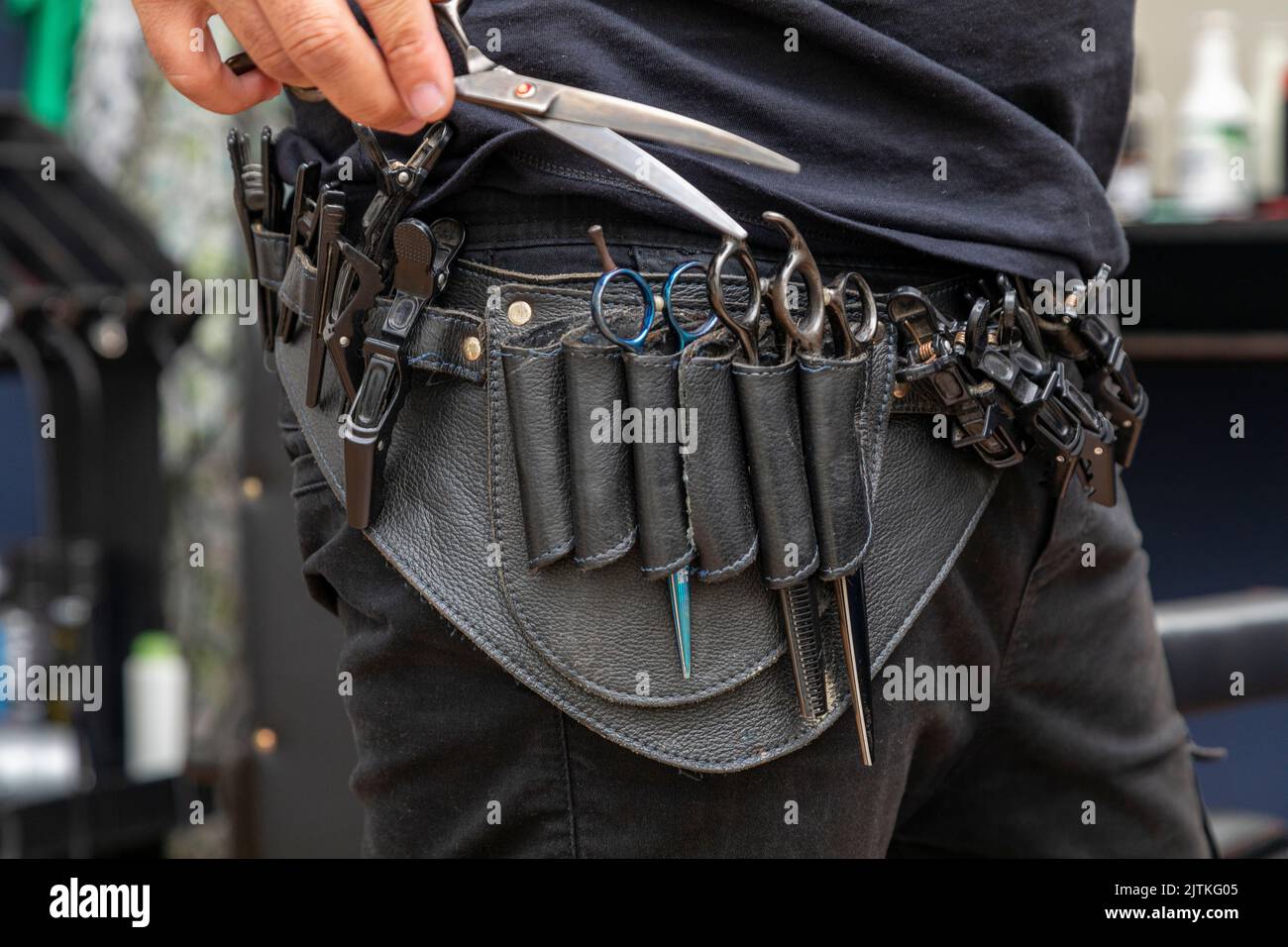 Leather barber belt with all the scissors at the waist Stock Photo - Alamy