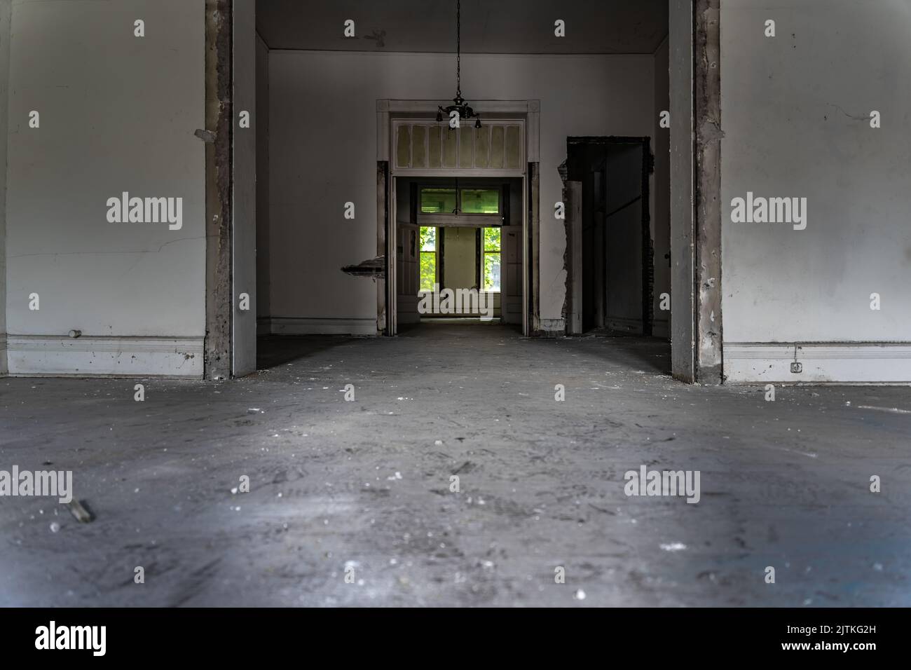 An old empty abandoned house rooms with gray destroyed walls and dirty ...