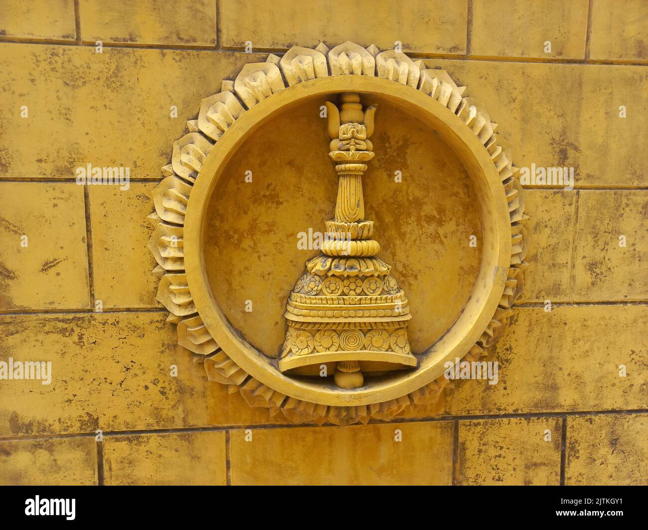 A Hindu Design Sculpture of an Ornate inside a Circle in the stone wall ...