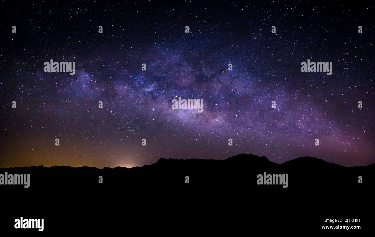 A breathtaking view of a milky way in the night sky in Dingle, Ireland ...