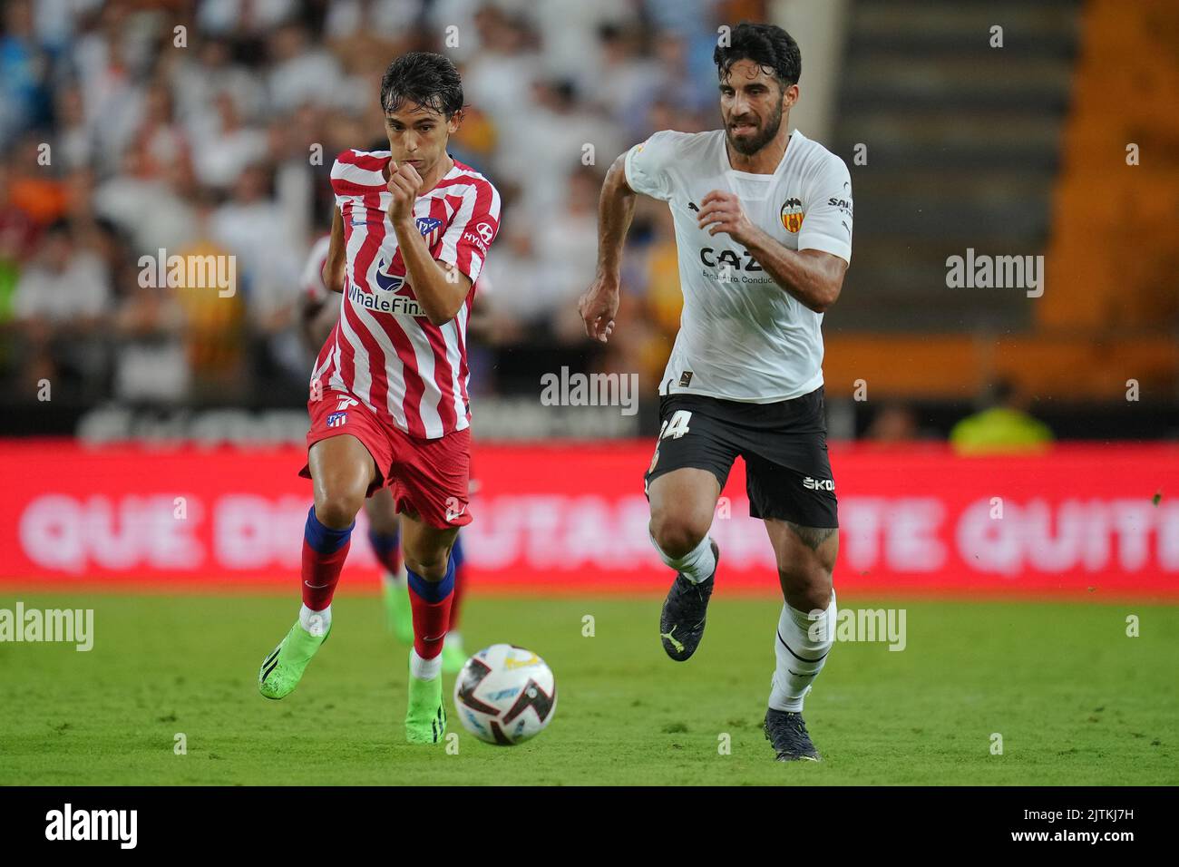 Joao Felix of Atletico de Madrid and Eray Comert of Valencia CF during the La Liga match between ...