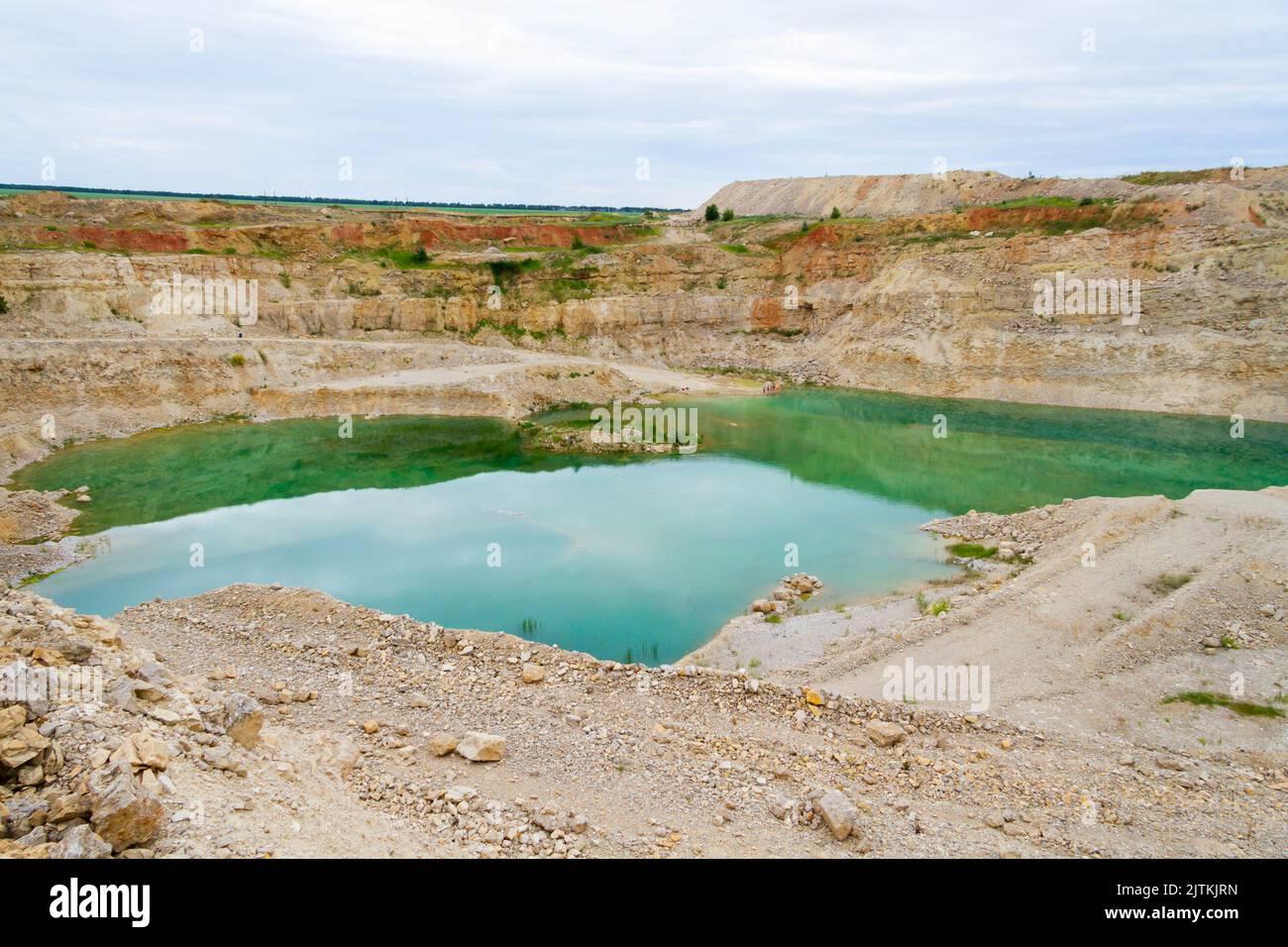 Lake formation in an old abandoned quarry. Quarry lake. Crushed stone ...