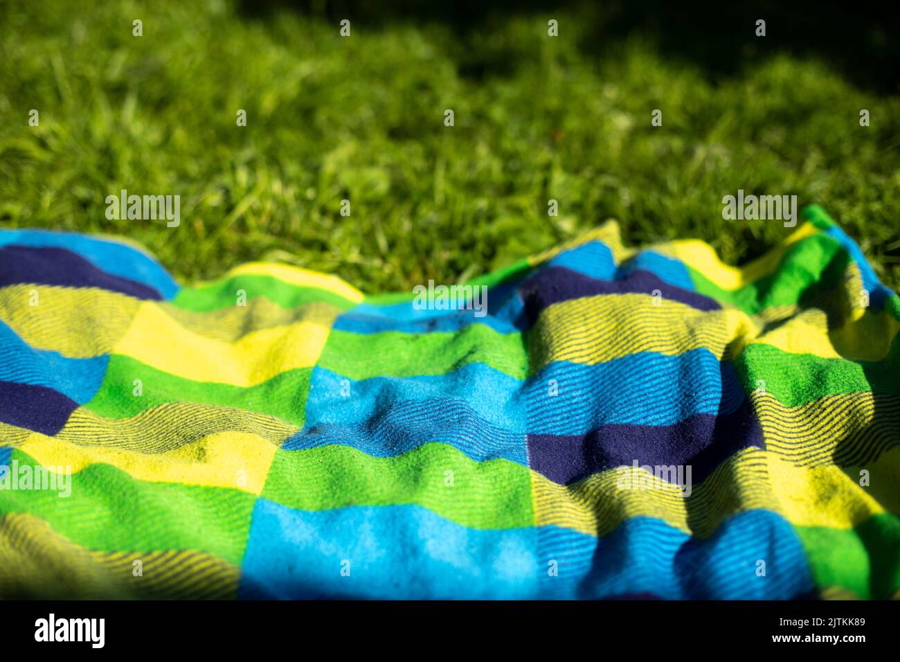 Plaid at picnic. Plaid in cage. Details of summer holiday. Fabric on ...