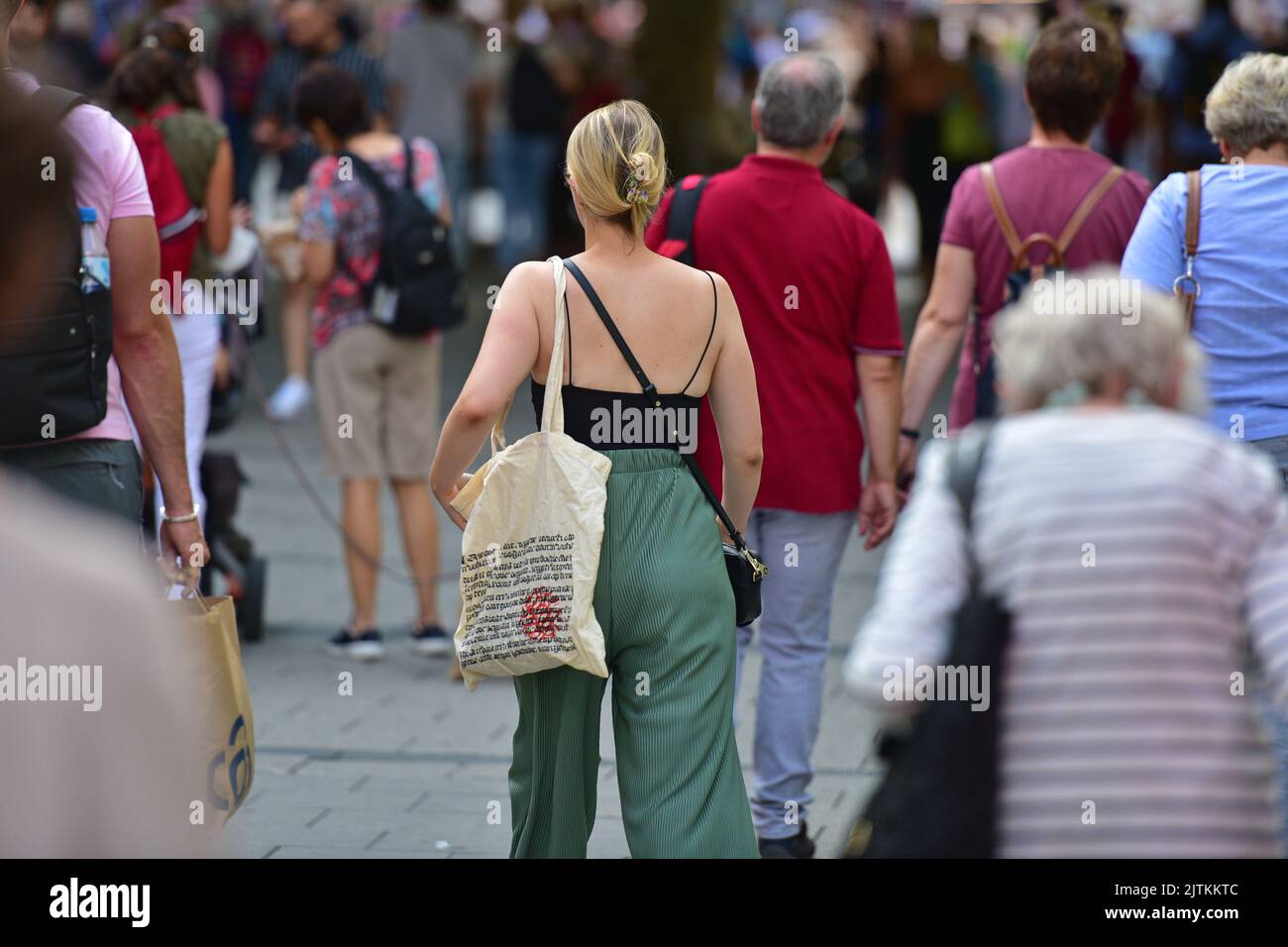 Street scene in the City of Munich with many busy people walking from ...