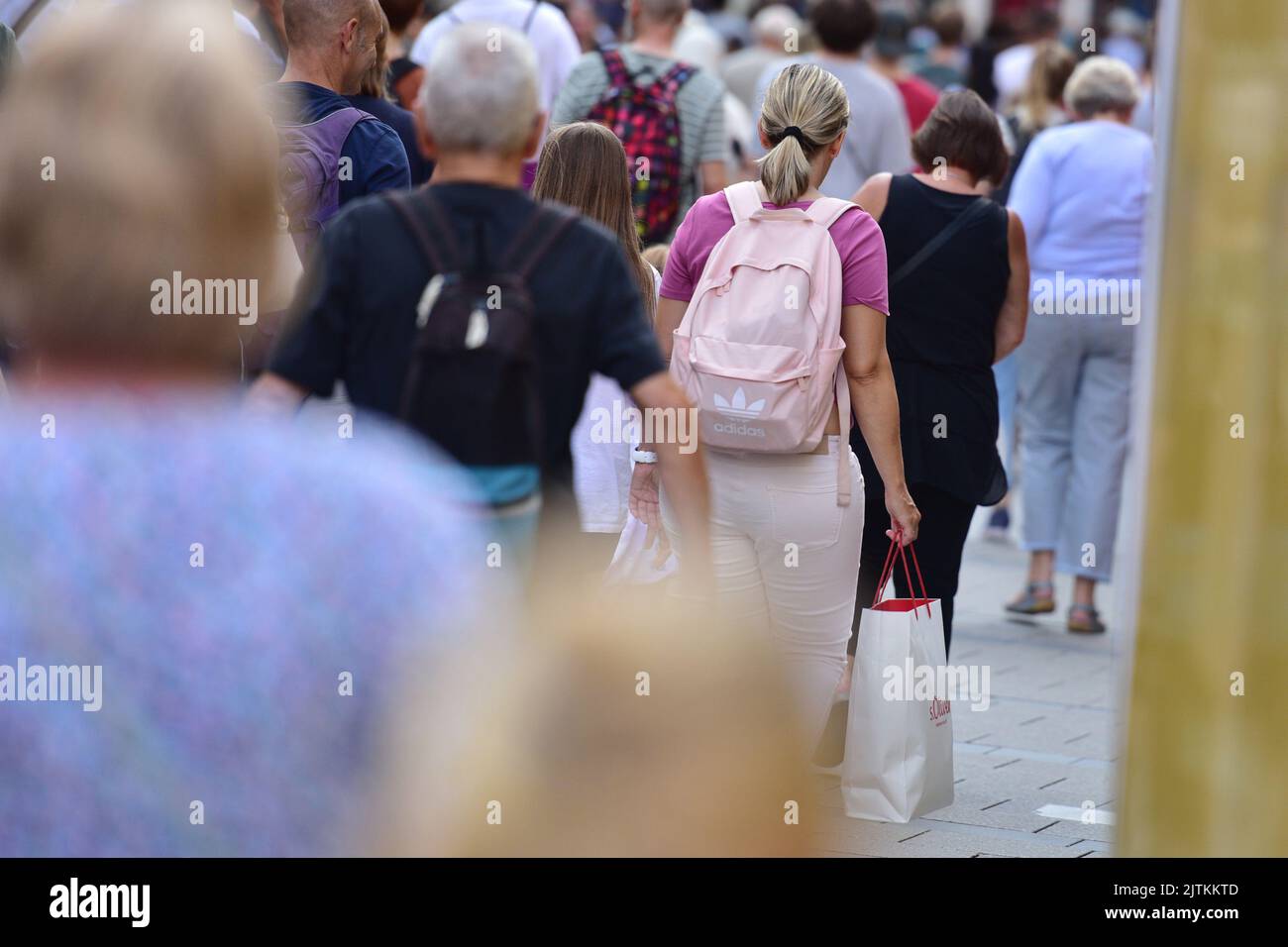 Street scene in the City of Munich with many busy people walking from ...