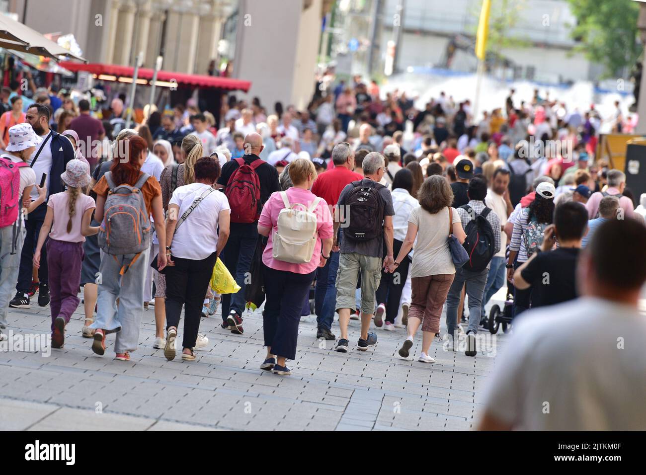 Street scene in the City of Munich with many busy people walking from ...