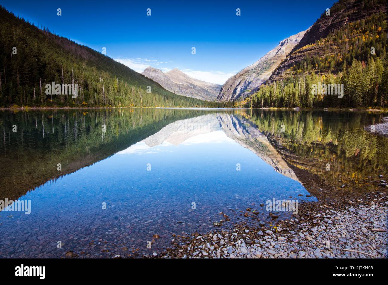 The beautiful Avalanche lake shore in Glacier National Park with ...