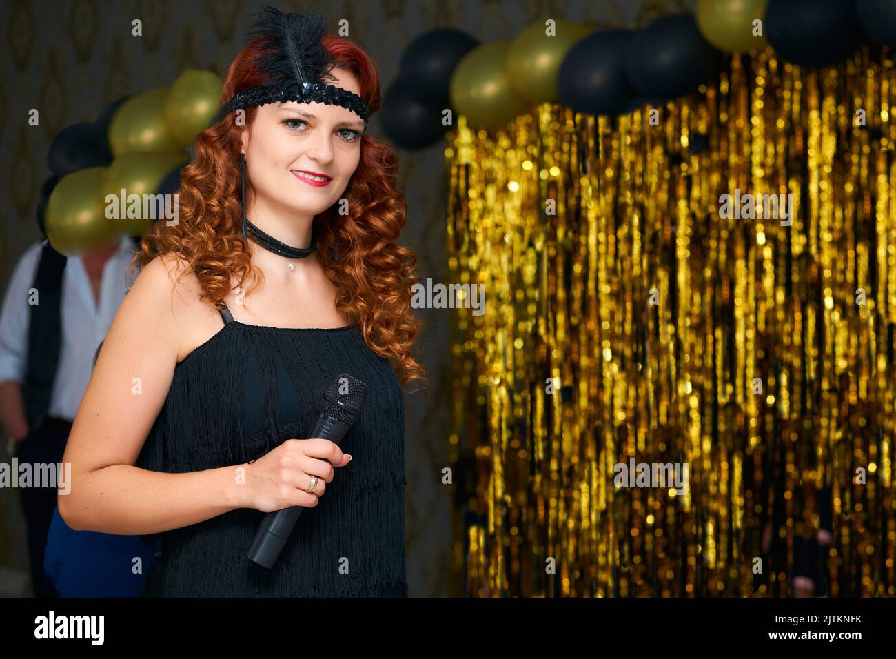 Cute event host woman, wedding presenter in black in vintage style on a ...