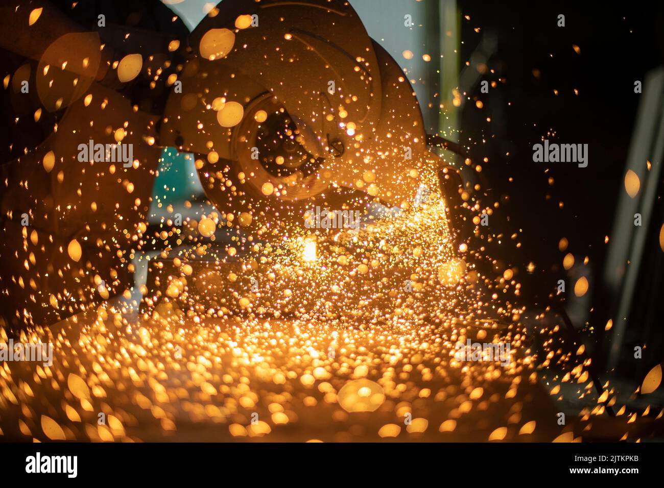 Sparks of metal. Steel sawing. Industrial background. Lots of bright ...